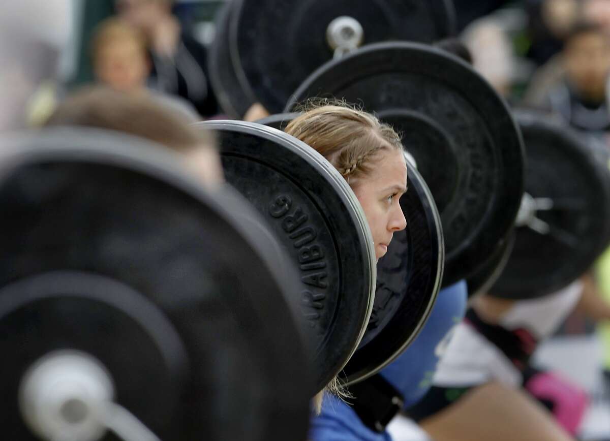 Hundreds sweat and strain at CrossFit contests on Treasure Island