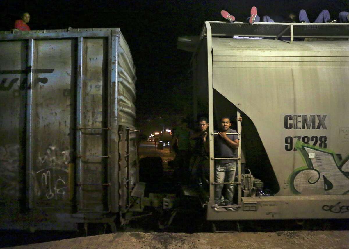 Photos show migrants riding trains through Mexico to U.S.