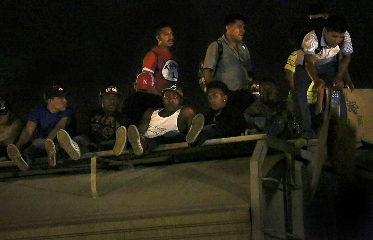 Photos show migrants riding trains through Mexico to U.S.