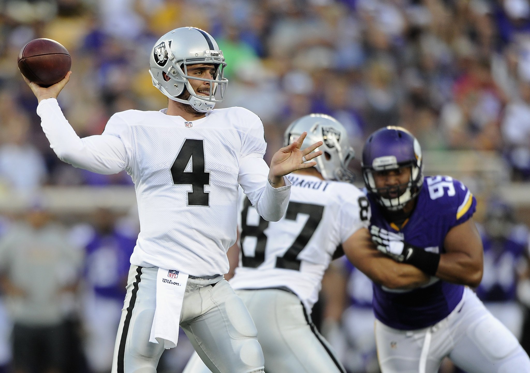 Derek Carr throws for 74 yards and an interception in NFL debut