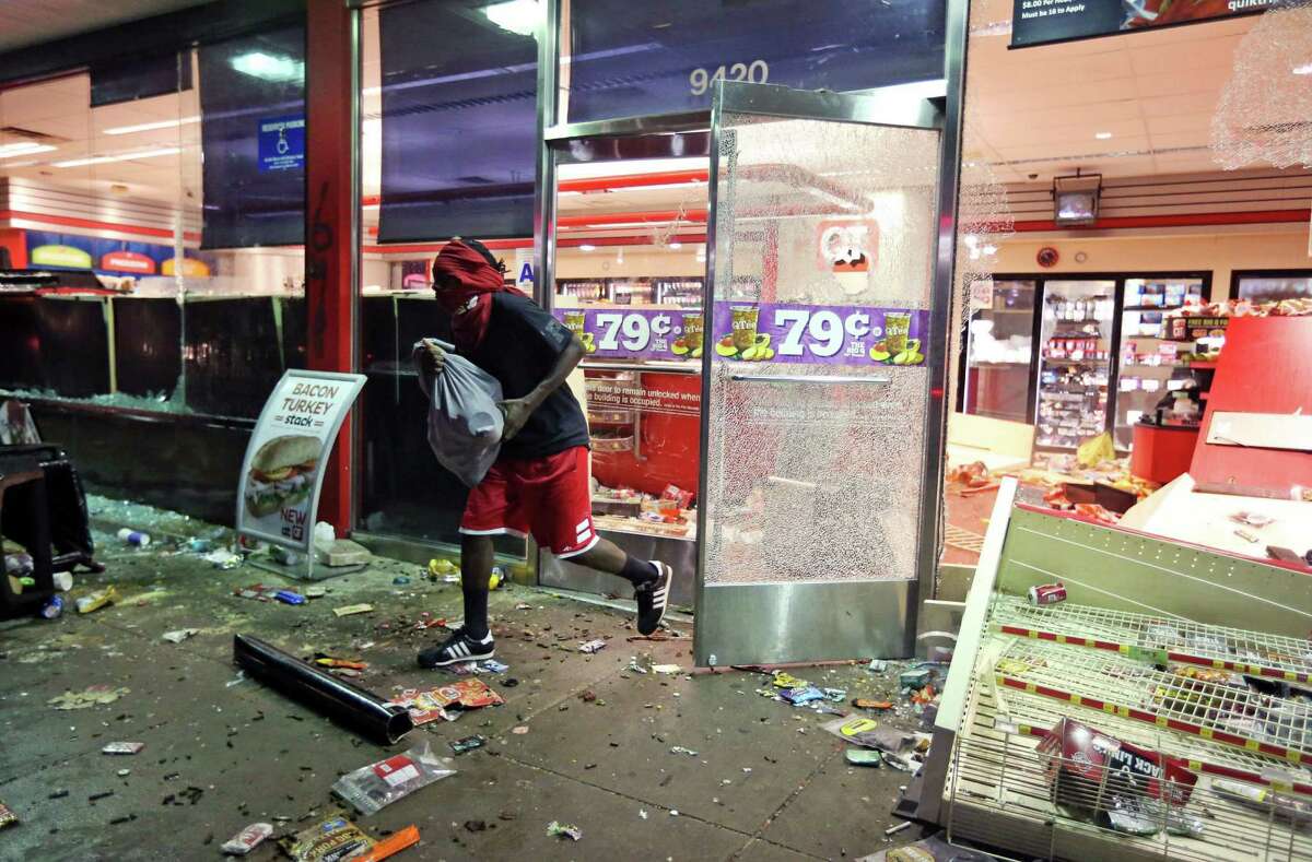 Vandalism, looting after vigil for teen shot by cop