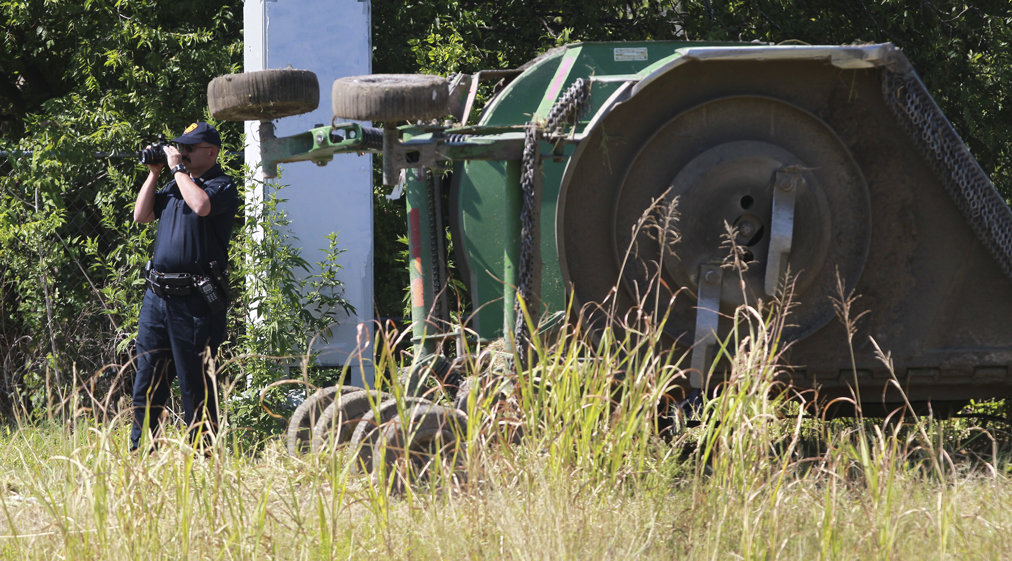 Mower's tractor runs over body in tall grass