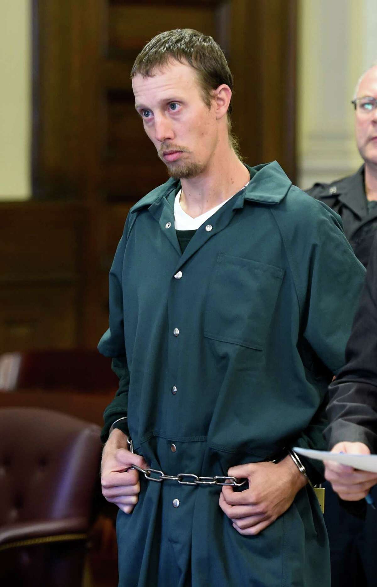 Two not guilty pleas in killings