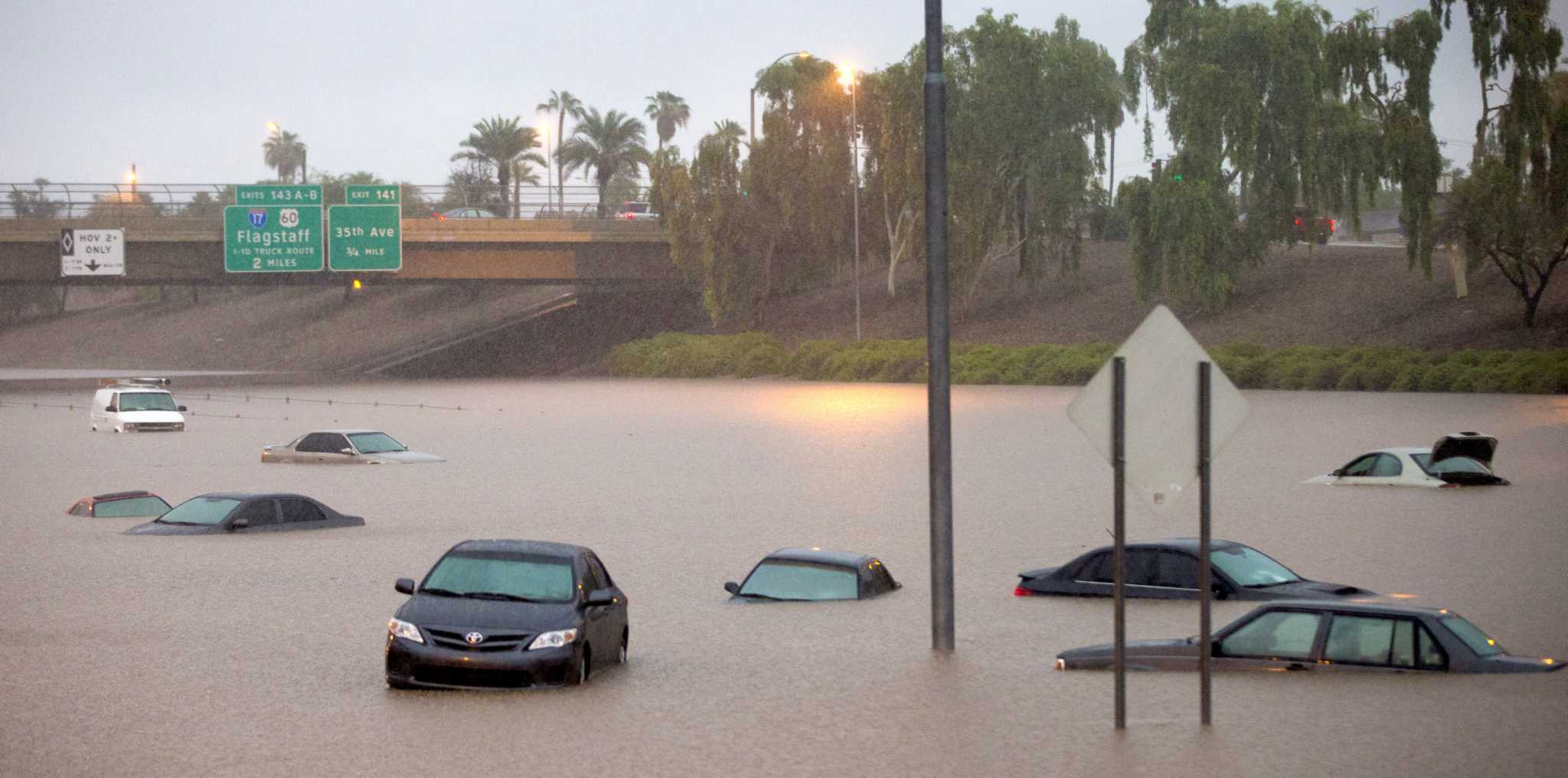 Cars engulfed as rain sets record for Phoenix