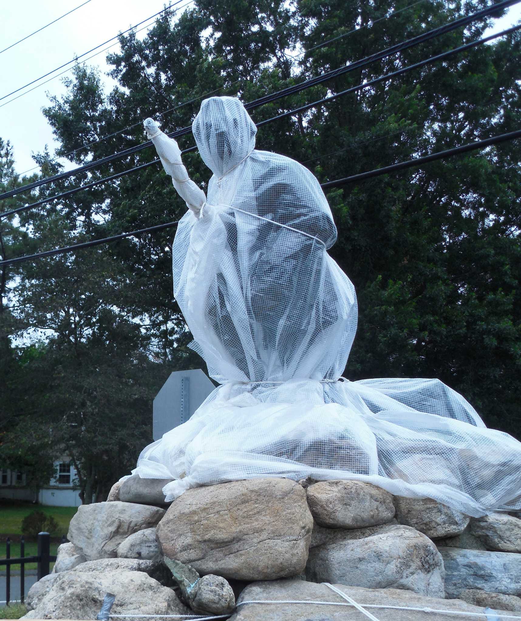 Minute Man statue takes cover ... for now