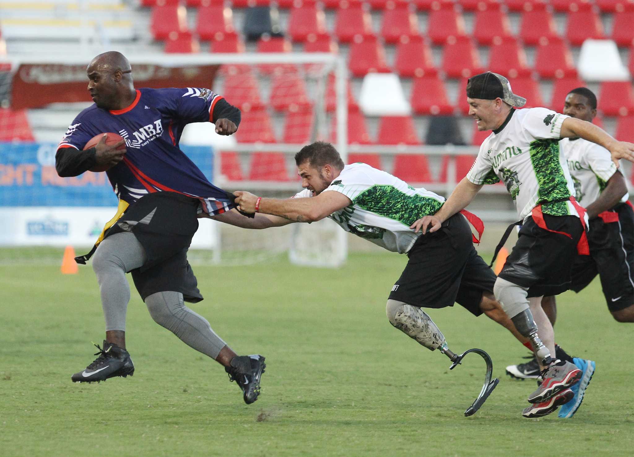 Amputee football team defies the odds against NFL greats