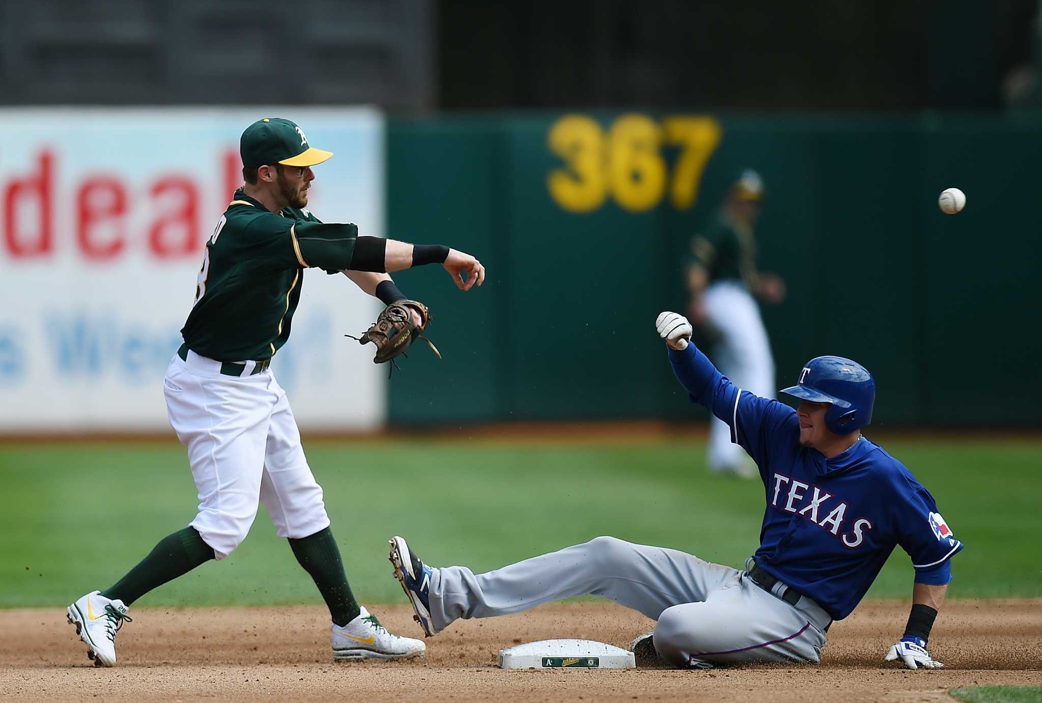 Rangers score 4 in 1st, A’s lose another