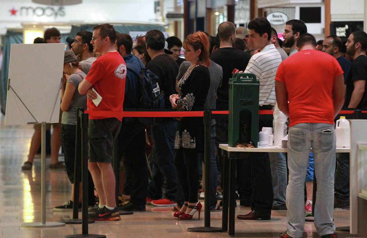 Guy drops new iPhone 6 on live TV, crowd gasps