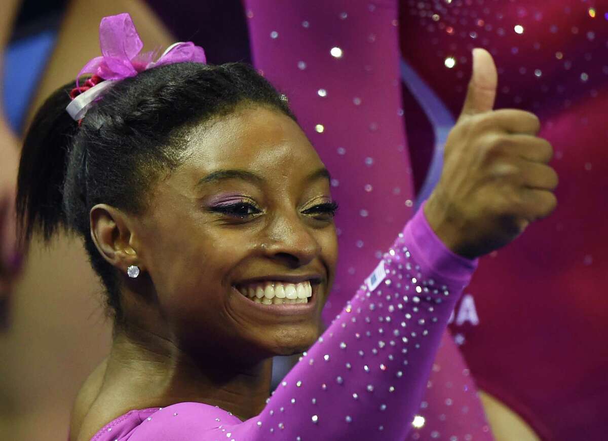 Simone Biles claims gold at 2014 world championships