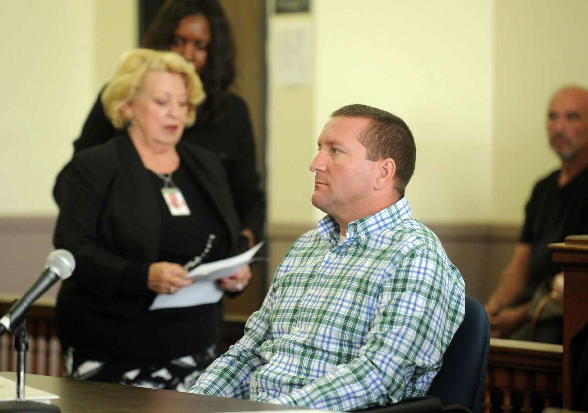 Ex-trooper gets 1 year for theft from dying motorist