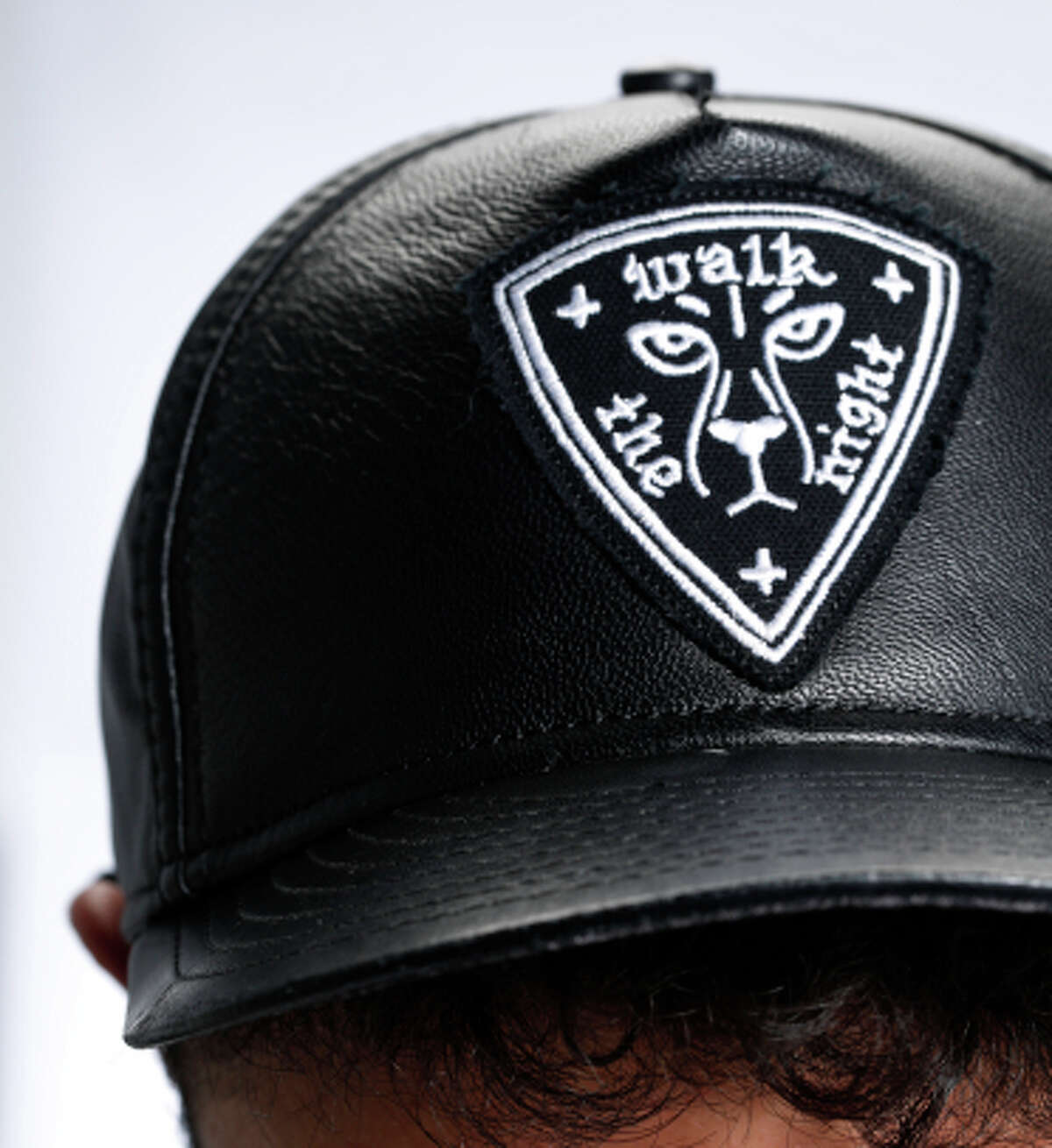 A tip of the ball cap