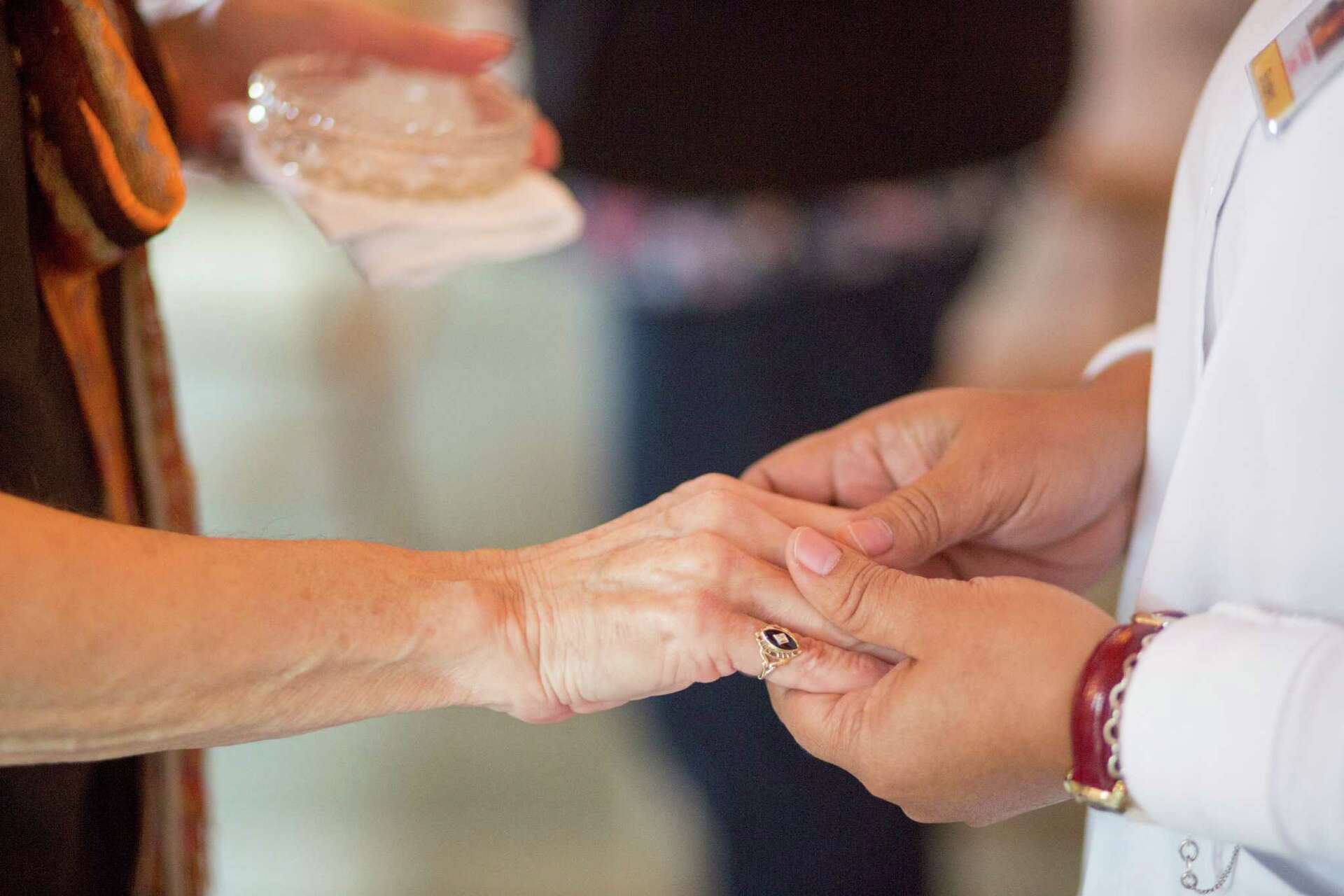 Hands of hospice workers blessed in prayerful ceremony