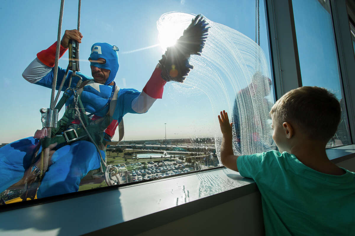 Window washers dressed as superheroes visit kids at Texas Children's ...