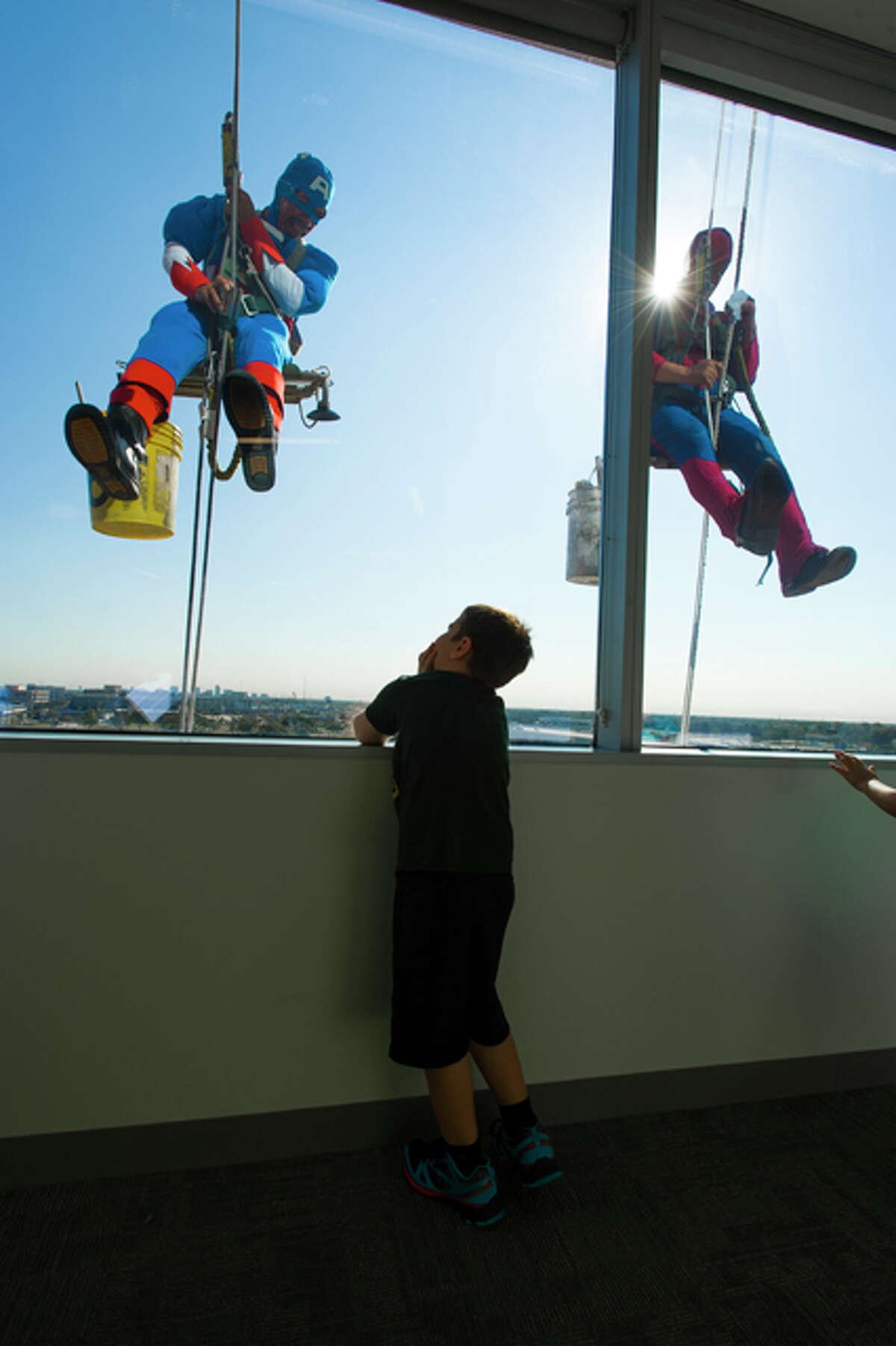 Window washers dressed as superheroes visit kids at Texas Children's ...