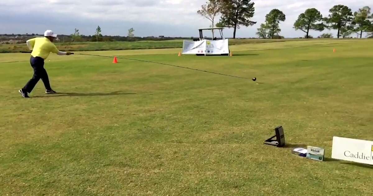 Texas man swings ridiculously giant golf club for a world record