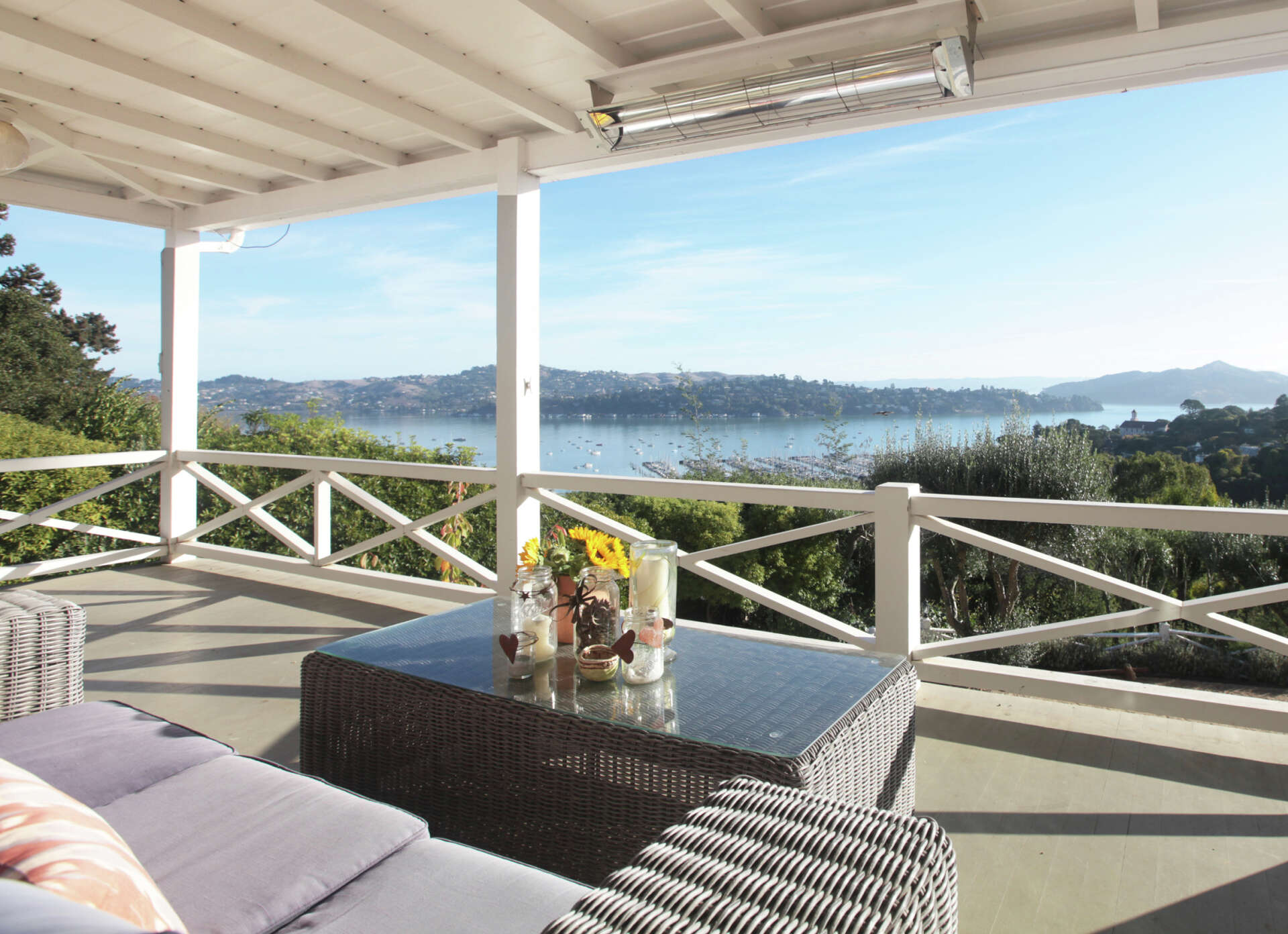 Covered veranda with bay views highlights Cape Cod-style home in Sausalito