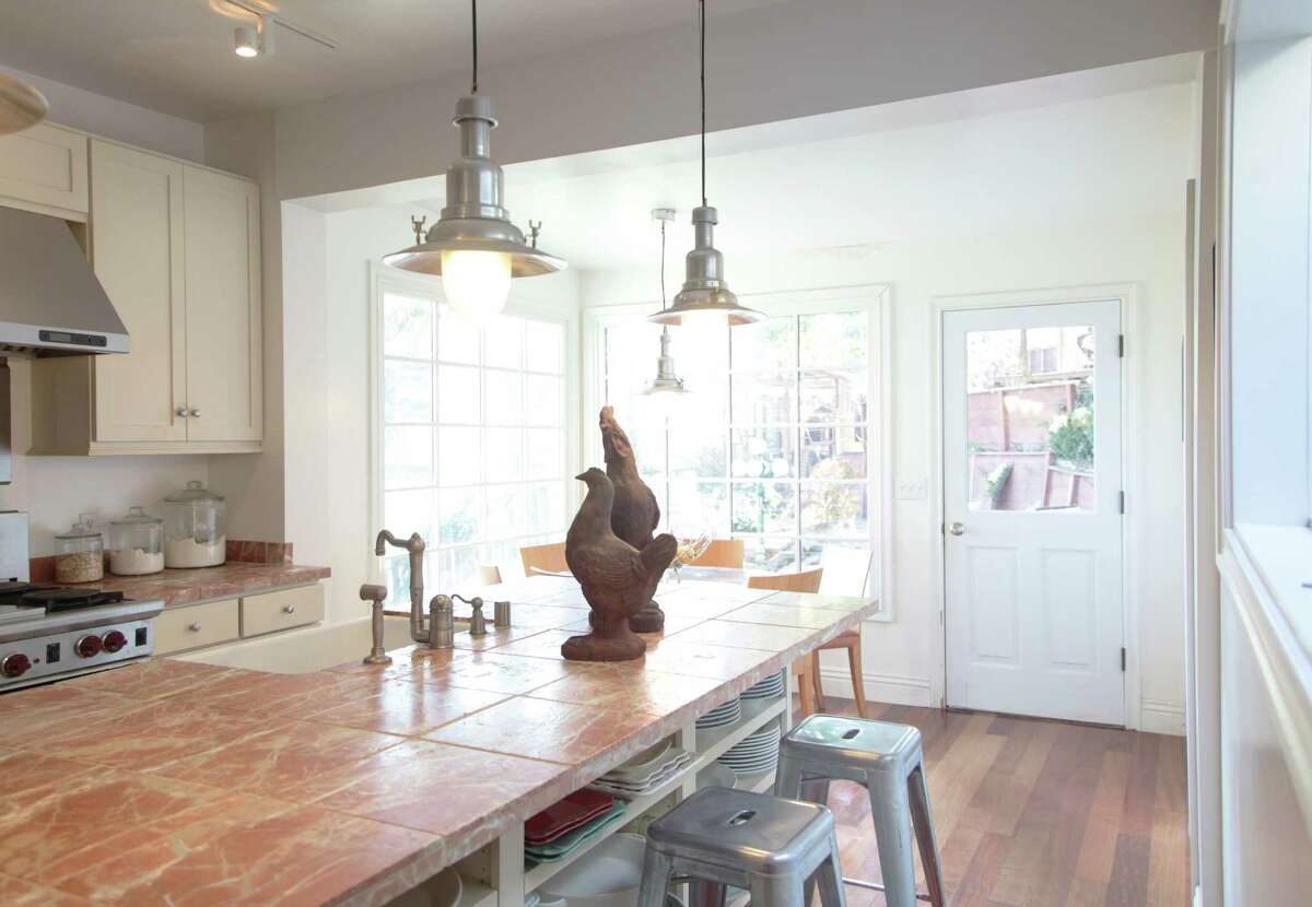 Covered veranda with bay views highlights Cape Cod-style home in Sausalito