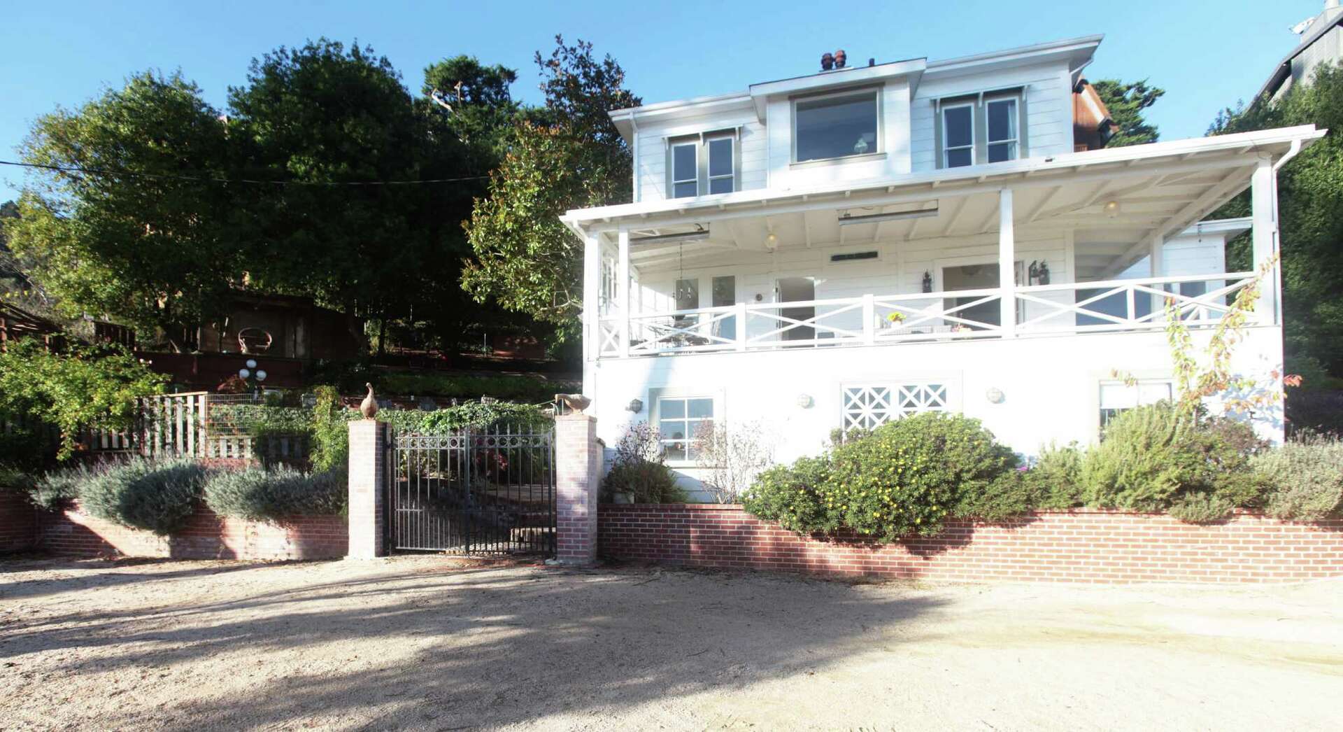 Covered veranda with bay views highlights Cape Cod-style home in Sausalito