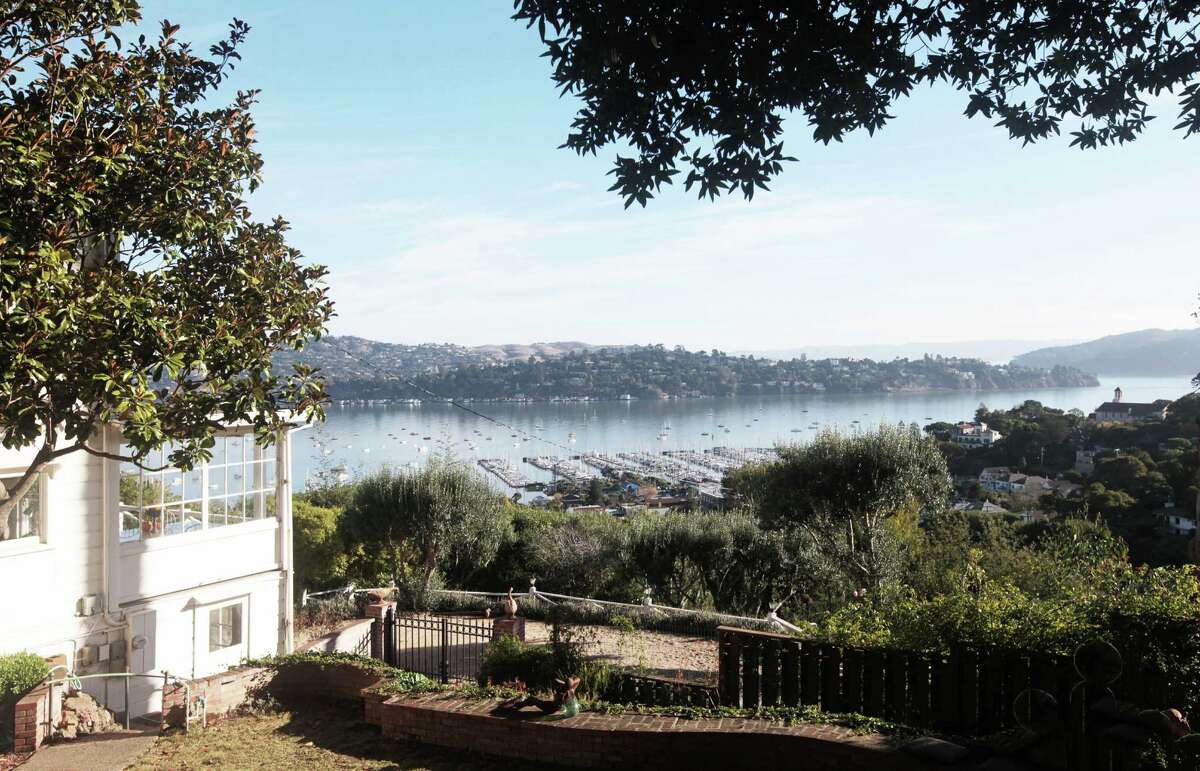 Covered veranda with bay views highlights Cape Cod-style home in Sausalito