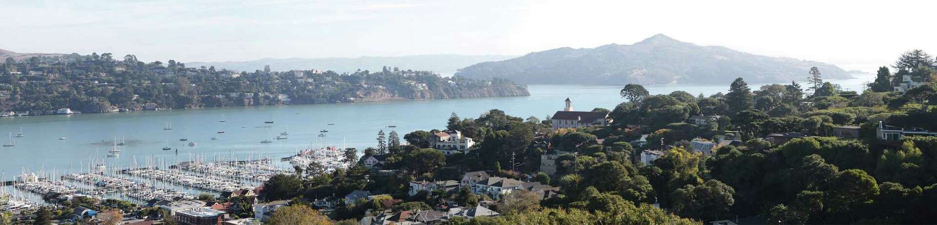 Covered veranda with bay views highlights Cape Cod-style home in Sausalito