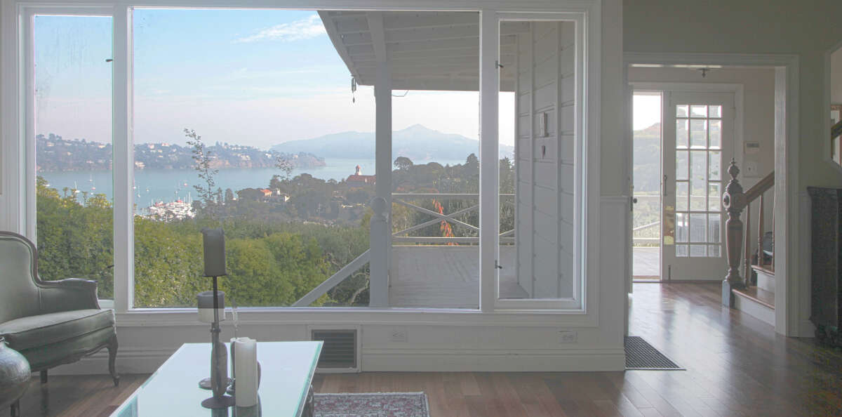 Covered veranda with bay views highlights Cape Cod-style home in Sausalito