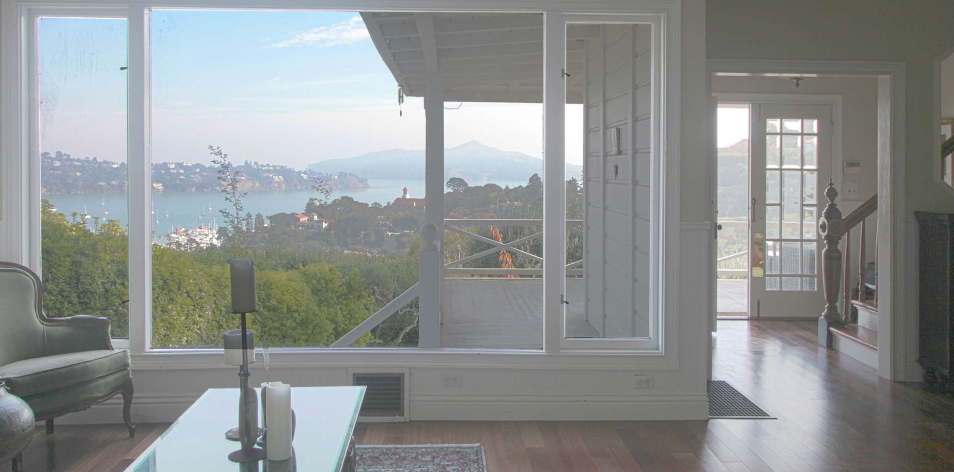 Covered veranda with bay views highlights Cape Cod-style home in Sausalito