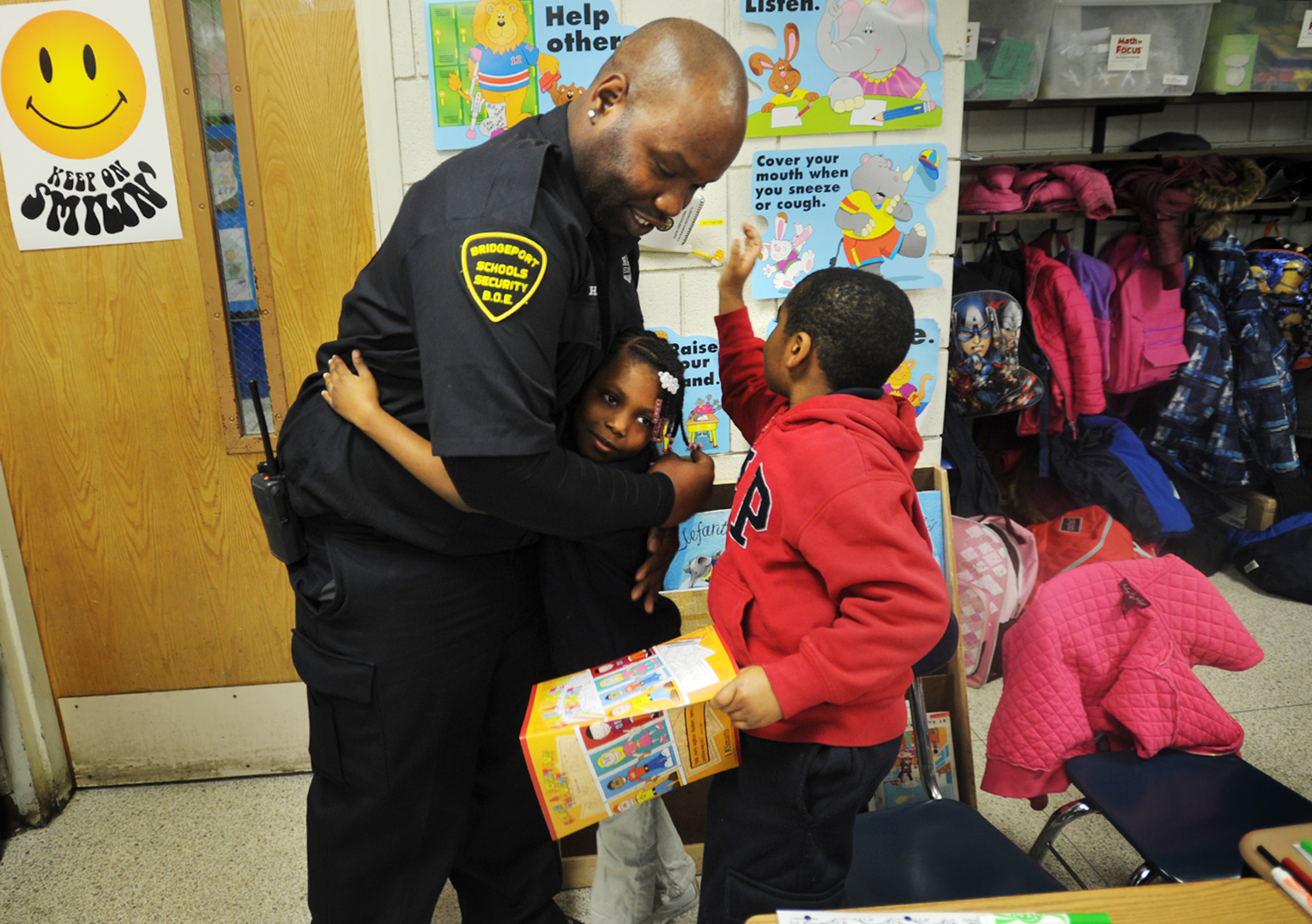 School security guard inspires students with coloring book