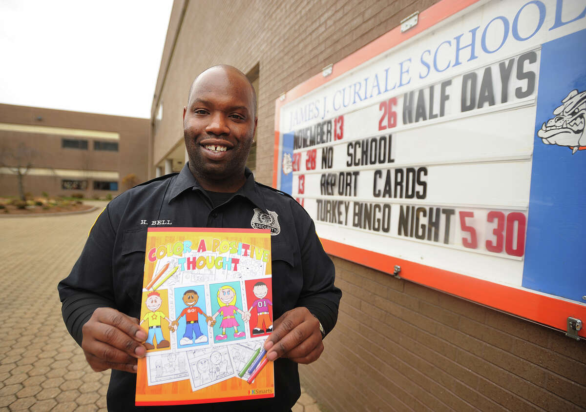 School security guard inspires students with coloring book