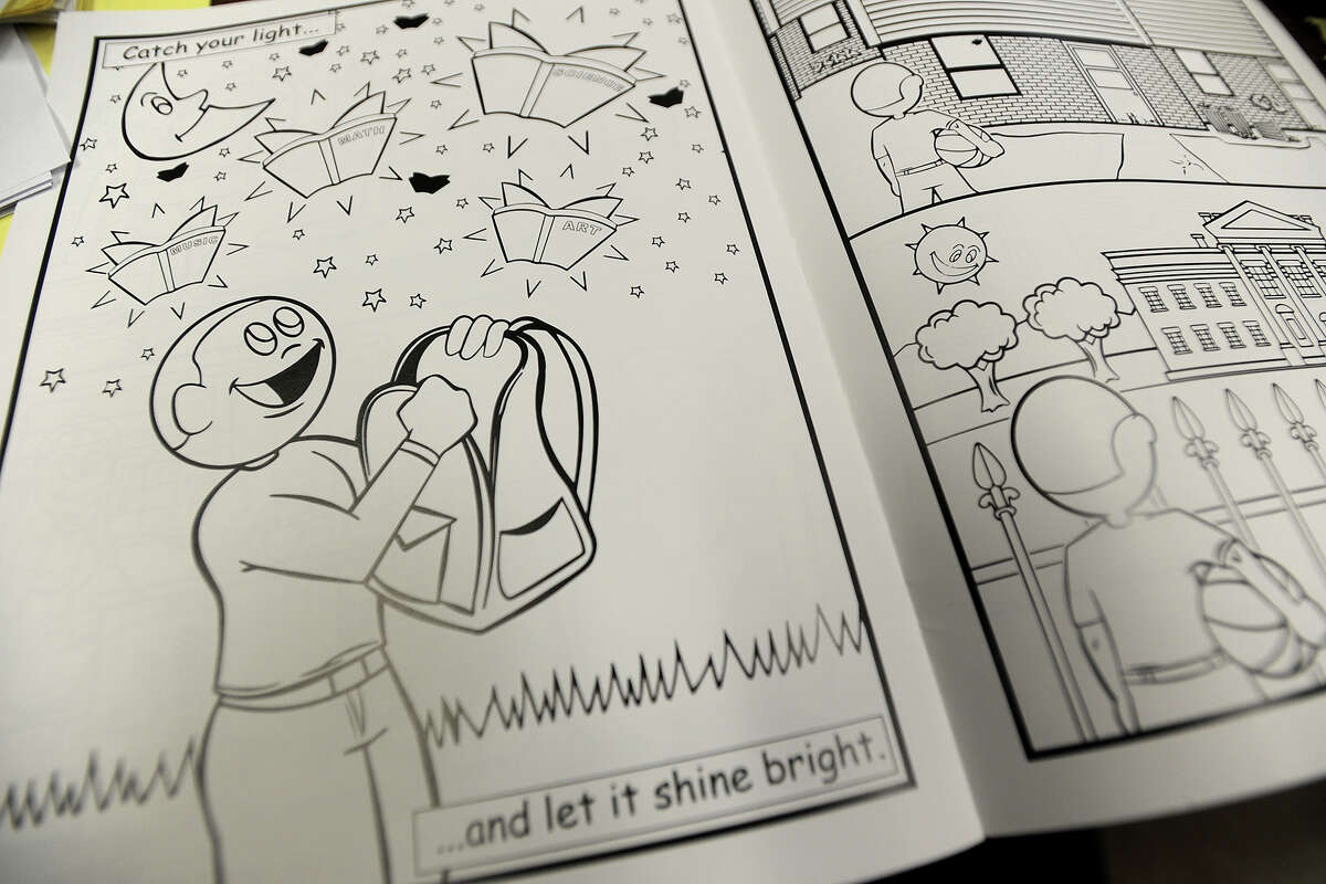 School security guard inspires students with coloring book