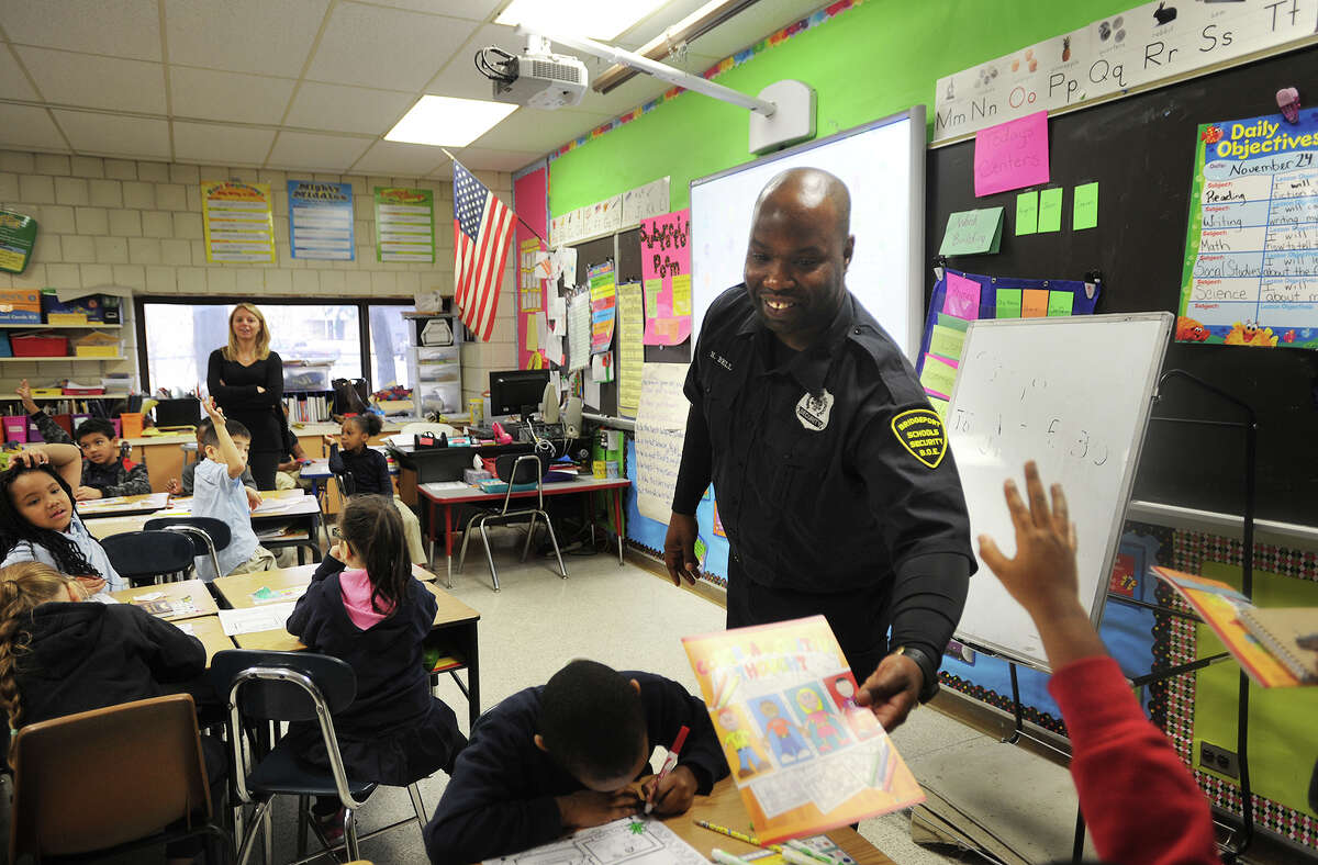 School security guard inspires students with coloring book