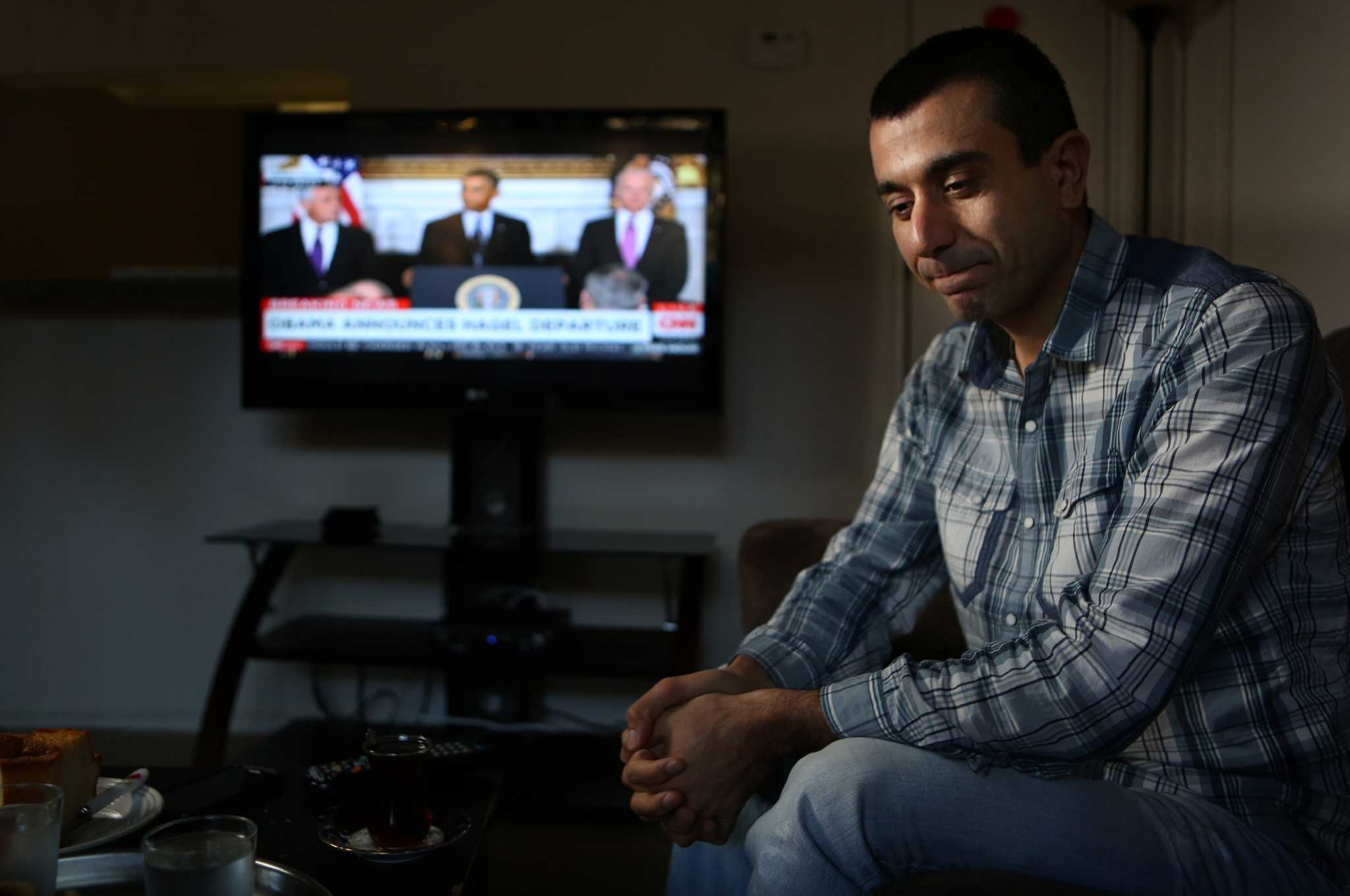 His mind is in Iraq. His life is in Houston.