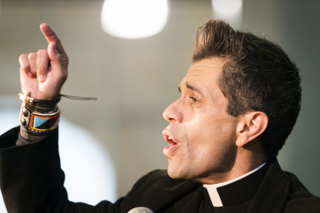 Father TJ Martinez, the priest who used hair gel