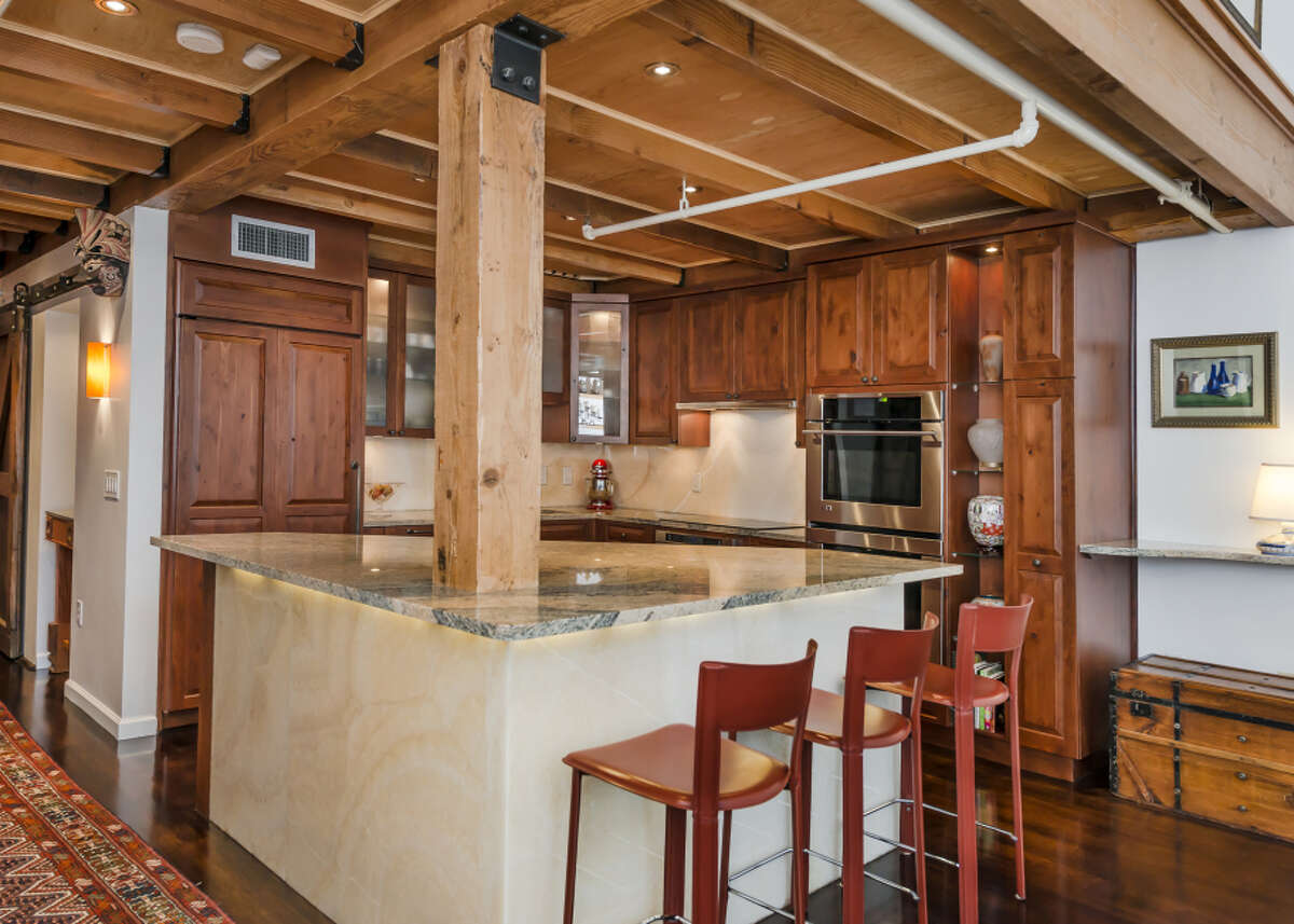 Warm finishes dominate two-bedroom loft in South Beach