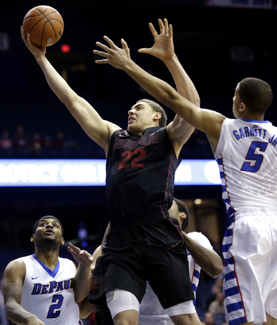 Freshman Reid Travis muscles into the picture at Stanford