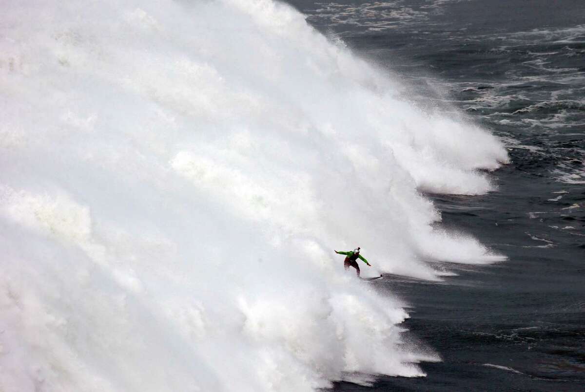 Surfers ride big waves