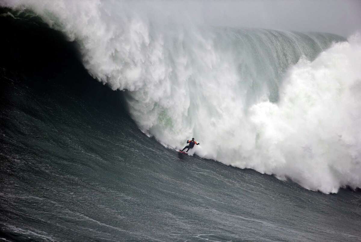 Surfers ride big waves