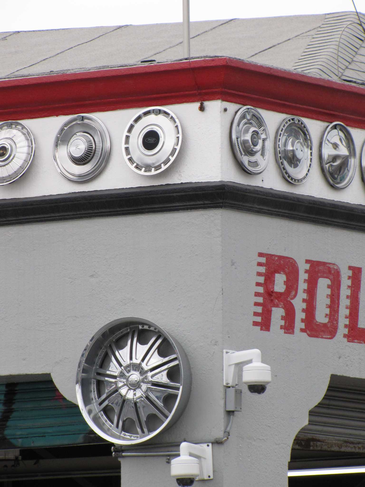 Hubcaps turn a Mission garage into an architectural cornice line