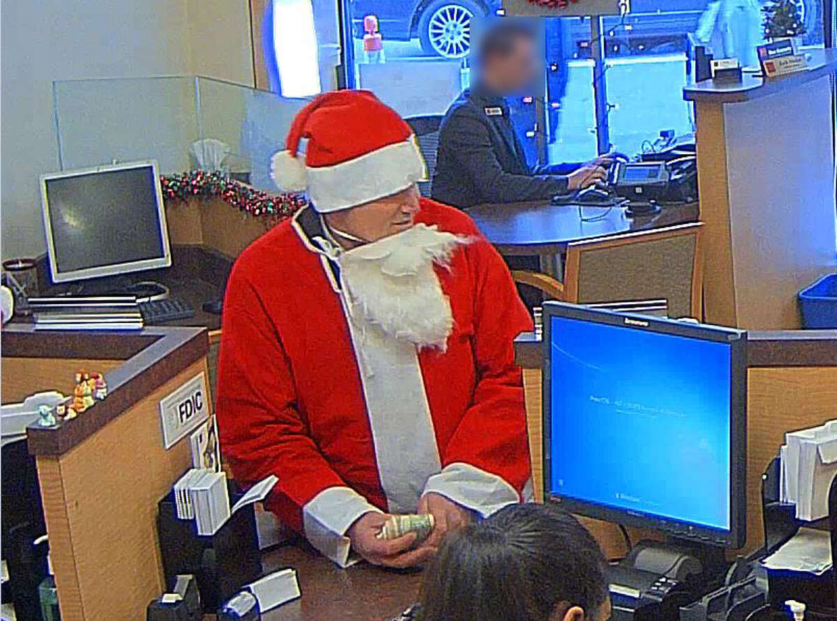 Pics released of Santa bandit who robbed bank during SantaCon