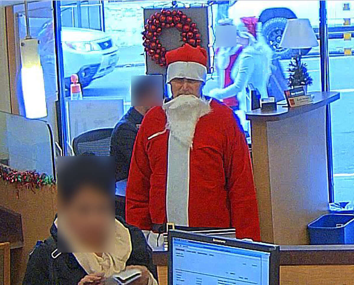 Pics released of Santa bandit who robbed bank during SantaCon