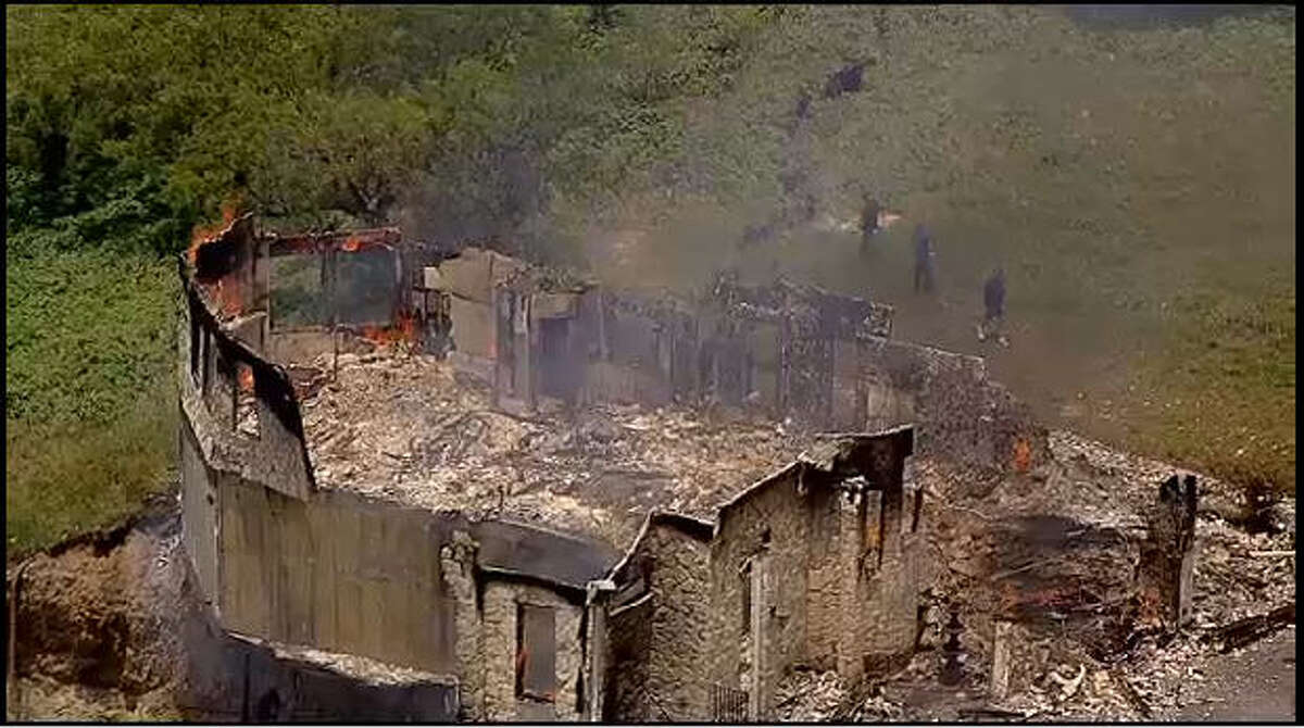 Rain-soaked cliff where burned luxury home once stood falls into Lake ...