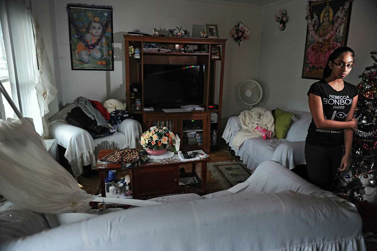 Crash into house injures occupant