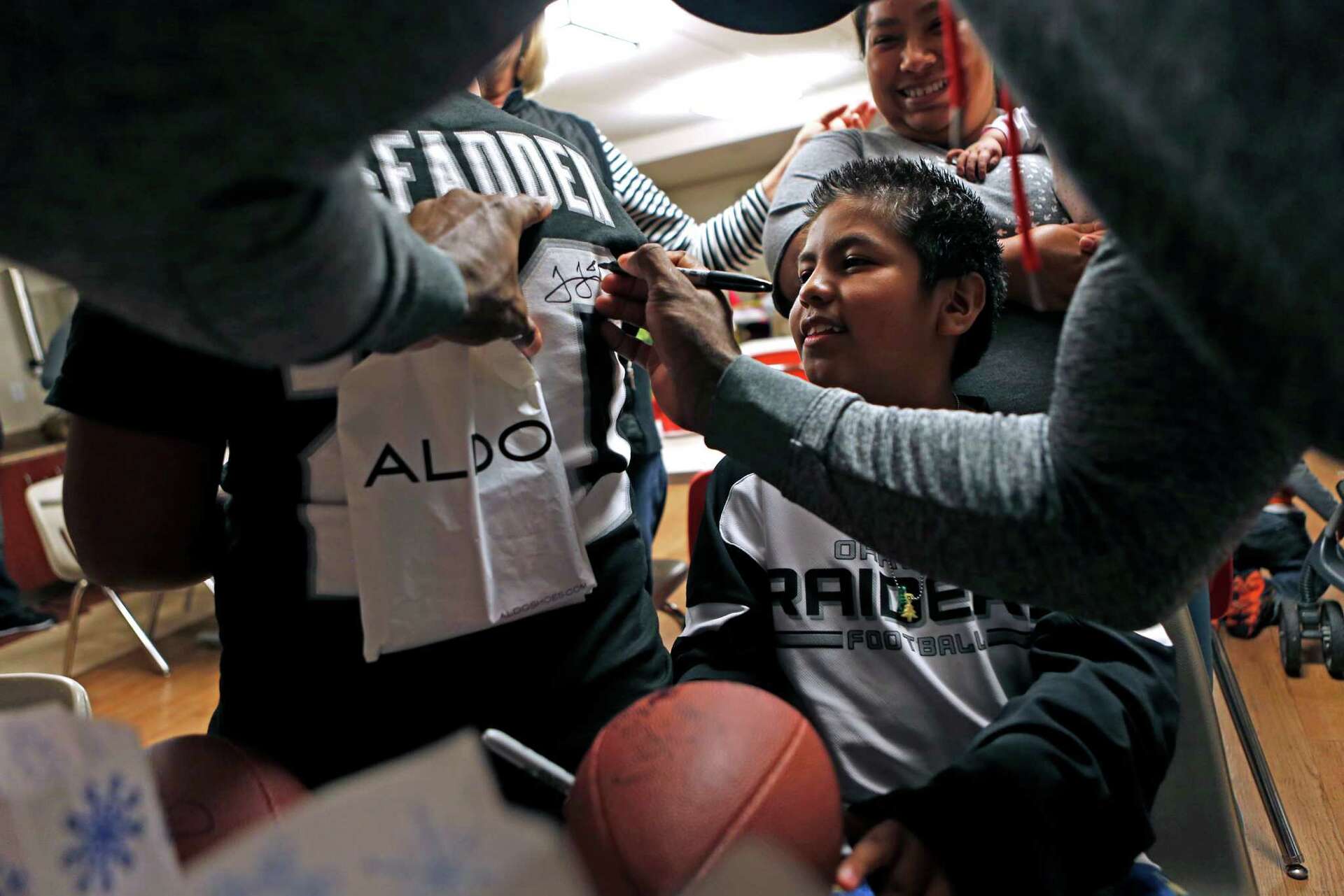 Once-homeless Raider James Jones brings hope to shelter children