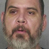 Cops: Shop owner beat employees with live lizard - SFGate