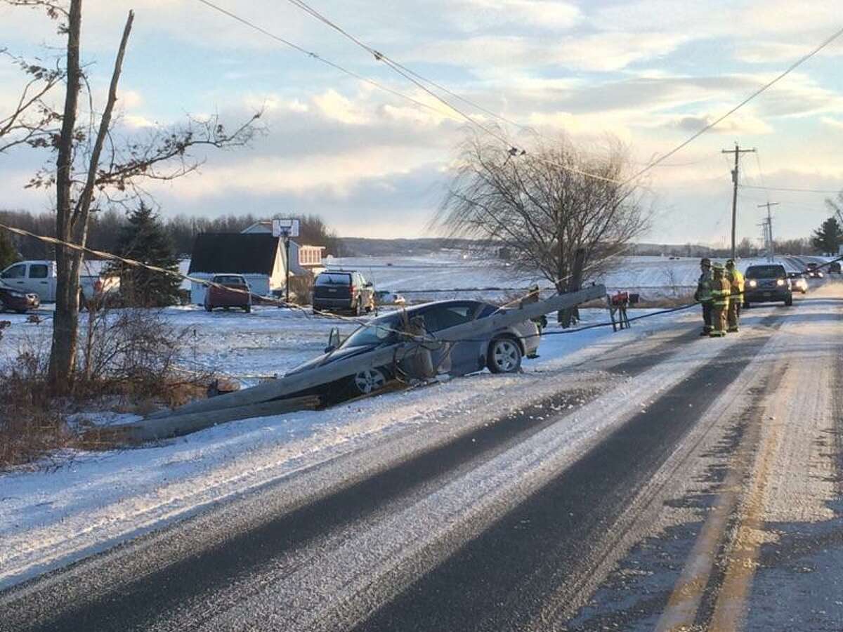 Downed power lines trap motorist