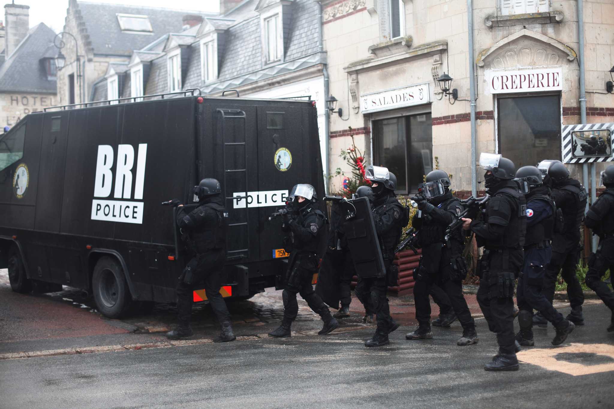 French police detain 9 in massive hunt for 2 suspects