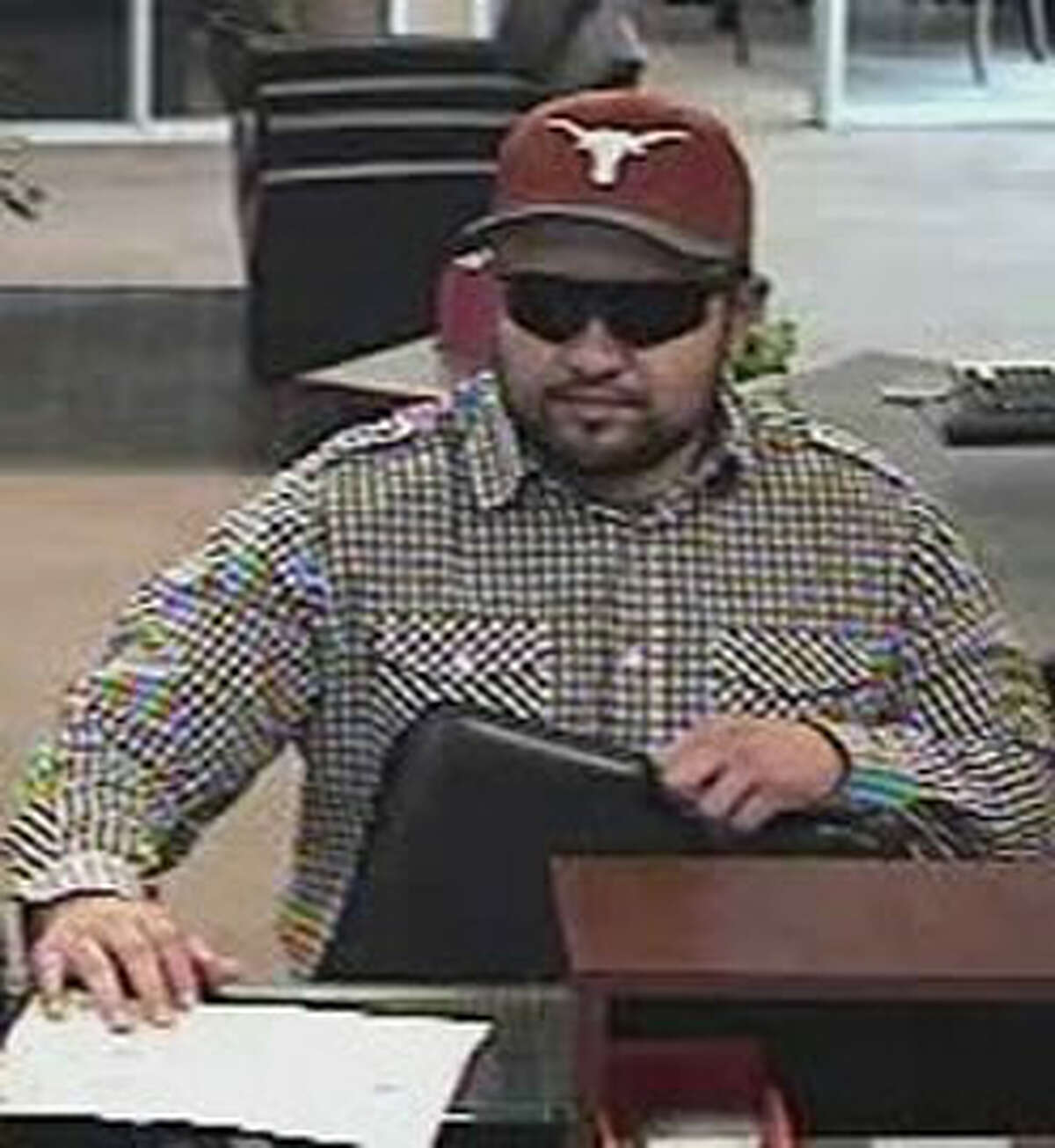 FBI on the hunt for cowboy hat-wearing bank bandit with hoax bomb