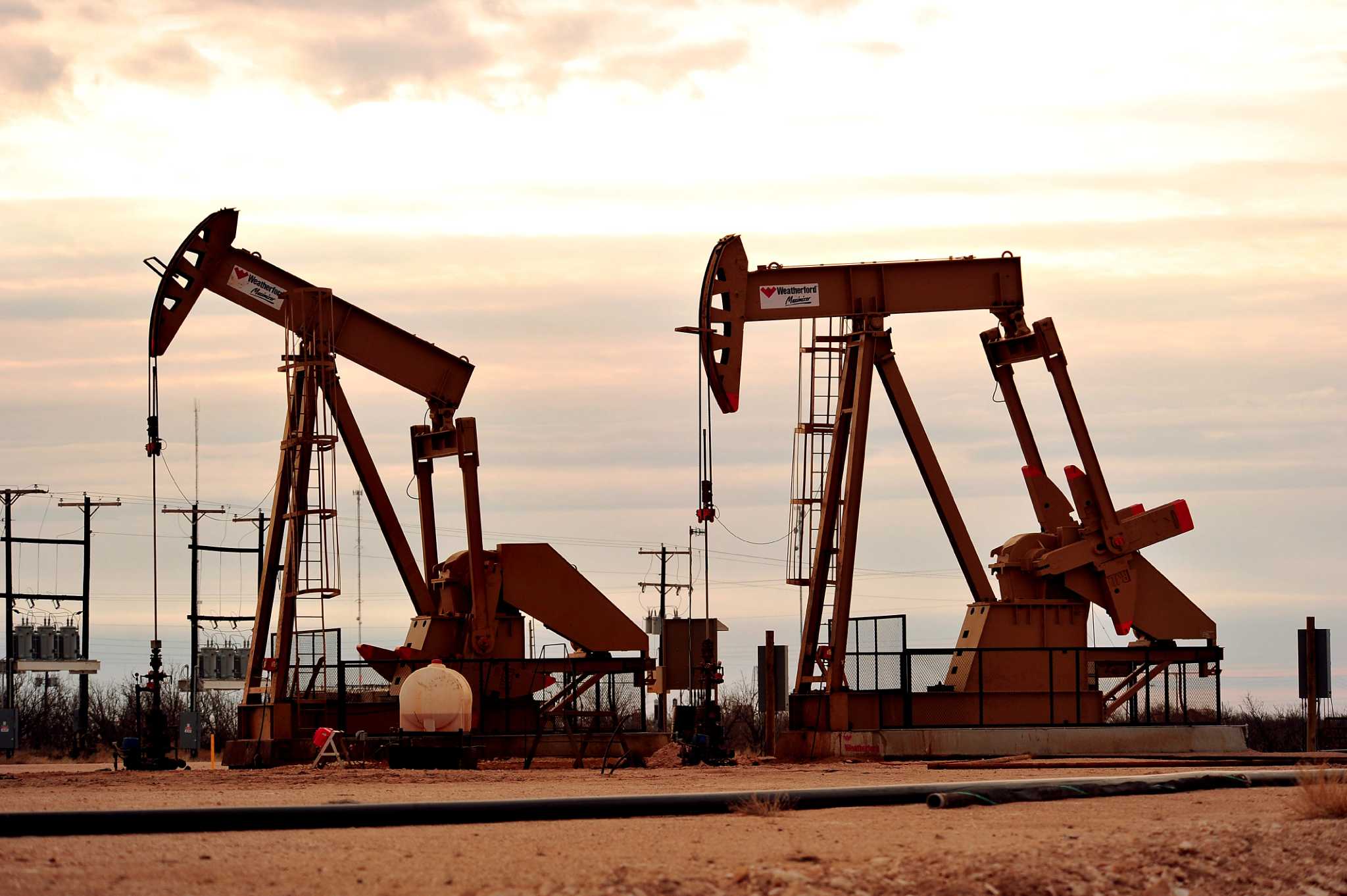 As rigs idle, a town in oil country reels