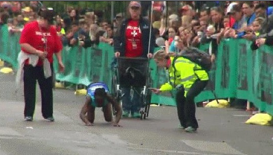 Austin Marathon runner crawls across finish line after intense physical ...