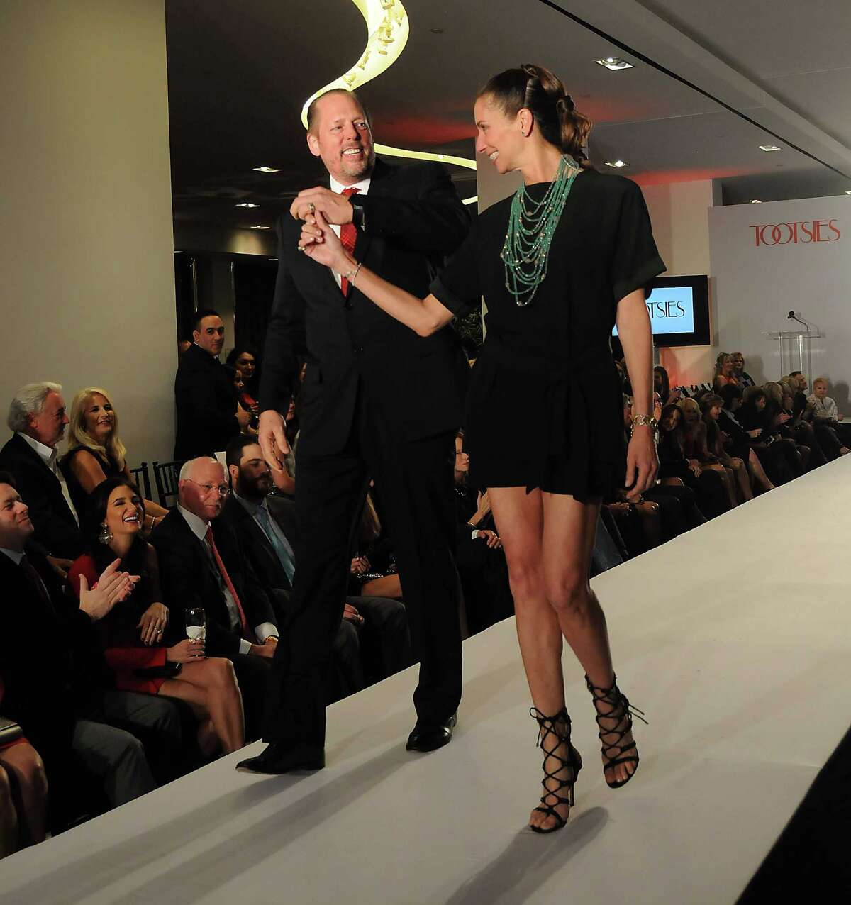 Texans players, power couples work runway at Tootsies