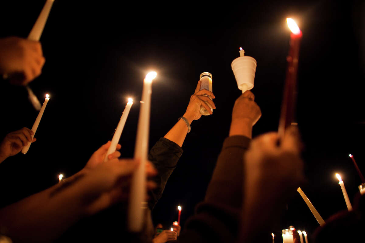 Students hold solemn vigil for slain friend